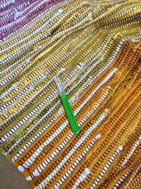 Plastic Pumpkin Makeover Using A Five Below Rug - The Shabby Tree